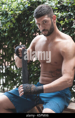 The hands of muscular man with bandage Stock Photo - Alamy