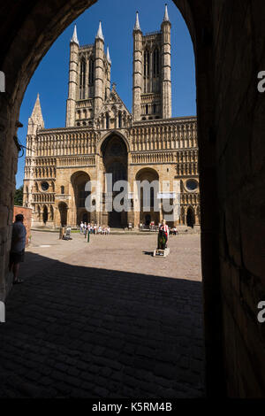 Exchequer Gate of Lincoln Cathedral framed by intricate Gothic ...