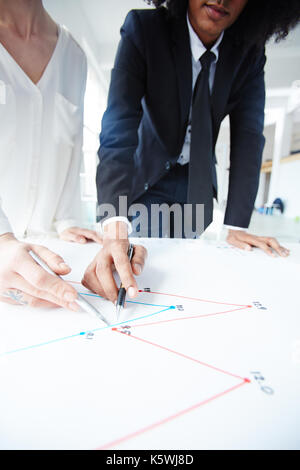 Business woman pointing at graph document close-up. Young business ...