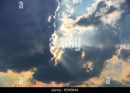 Sunrise light rays shine over mountains onto Lake Garda in Italy Stock ...