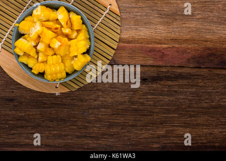split corn on wood background, View from above with copy space Stock ...