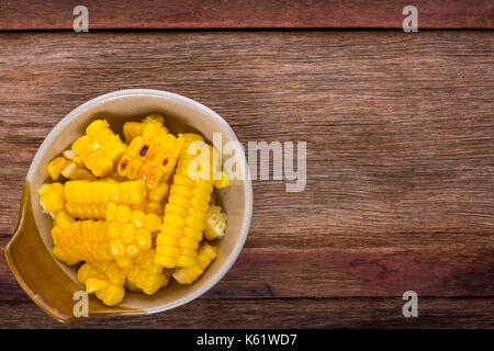 split corn on wood background, View from above with copy space Stock ...