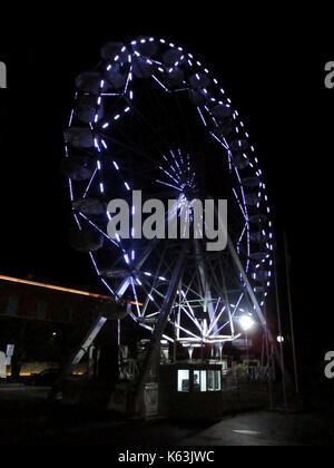 night shot carousel, panoramic wheel, illuminated Stock Photo - Alamy