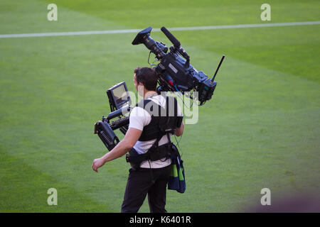 Television Cameraman filming a Football match. Picture by James ...