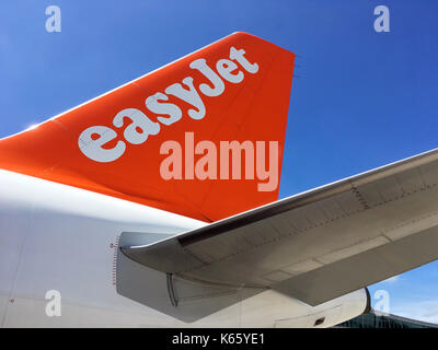 EasyJet airplane tail fin with blue sky Stock Photo - Alamy