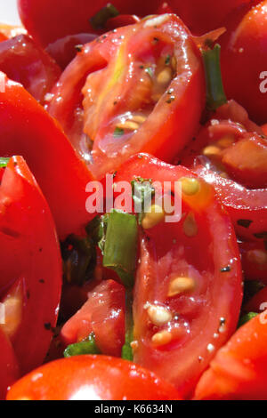 Red sliced tomatoes are ready for salad Stock Photo - Alamy