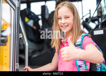 Great Portrait Of School Pupil Outside Classroom Carrying Bags Stock ...