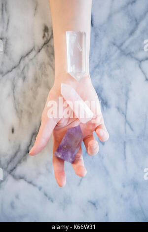 Healing crystals on female hand background, seven chakra stones Stock ...