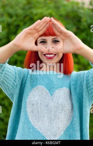 Hands showing the triangle sign Stock Photo - Alamy