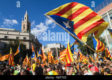 Catalans waving Catalan Independence flags on National Catalonia day ...