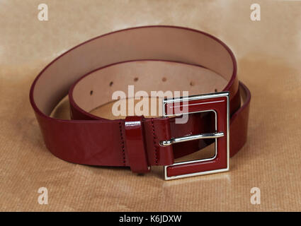 Shiny dark red patent leather belt accessory Stock Photo - Alamy