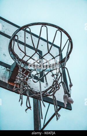 Urban Basketball hoop with worn out ripped net Stock Photo: 158995373 ...