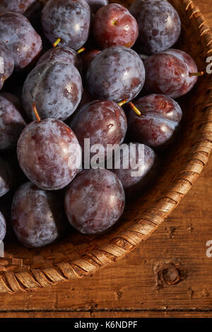 a basket bowl of fresh plums Stock Photo - Alamy