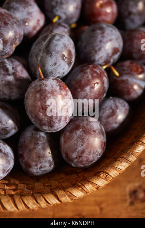 a basket bowl of fresh plums Stock Photo - Alamy