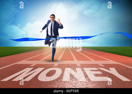 Businessman running towards money on track Stock Photo: 163504131 - Alamy