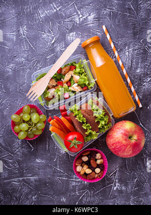 Lunch box with sandwich, vegetables and juice. School or office meal ...