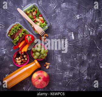 Lunch box with sandwich, vegetables and juice. School or office meal ...