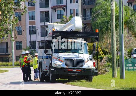 FPL Electrical Utility Truck Parked on Neighborhood Street as Linemen ...