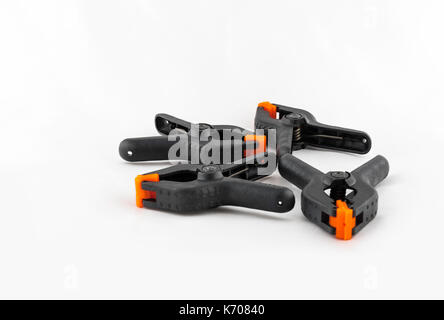 Four heavy duty clamps on a white background. Silo, cutout, cut out ...