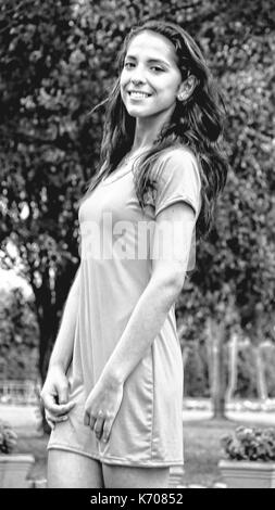 Young hispanic woman wearing skirt dancing on camera isolated over ...