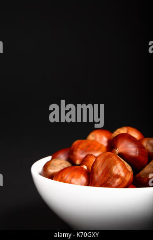 a dish full of chestnuts. autumn food Stock Photo - Alamy