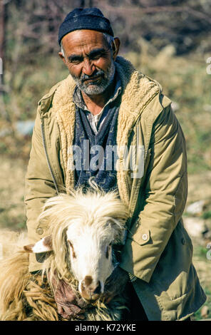 Iranian farmer with goat Stock Photo - Alamy