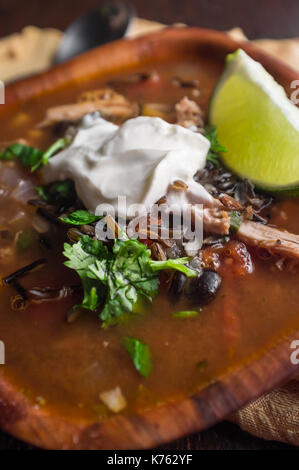 Hot spicy corn cream soup with fried bacon and shrimps. Seafood lunch a ...