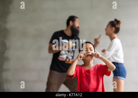 Children Fighting In Front Of Mother At Home Stock Photo - Alamy