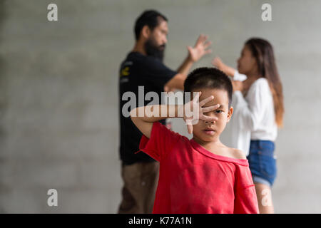 Children Fighting In Front Of Mother At Home Stock Photo - Alamy