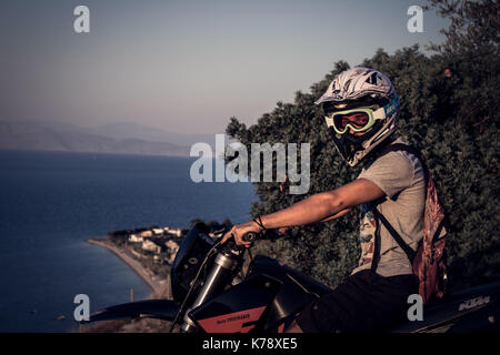 biker and his motorcycle on the edge of a cliff Stock Photo - Alamy