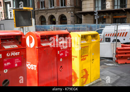 Australia Post mail letter boxes in Sydney city centre, the yellow box ...