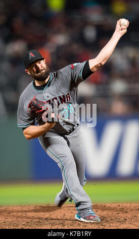 San Francisco Giants pitcher Robbie Ray, right, sits in the dugout ...