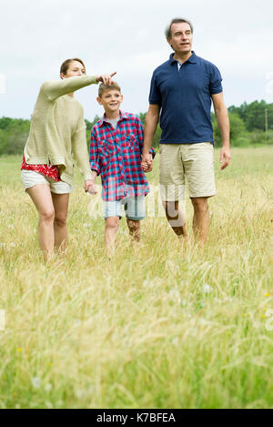 Mother holding child, pointing together, enjoying the scenic view and ...