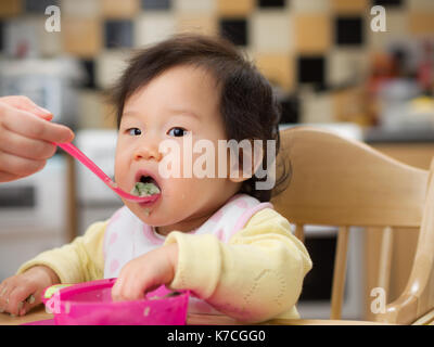 baby eating messy mashed potato Stock Photo - Alamy