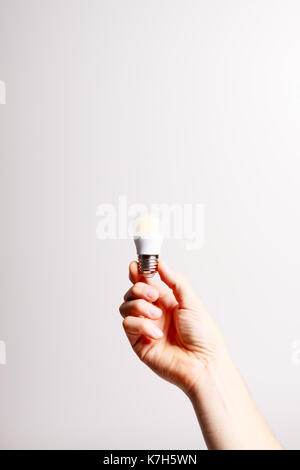 Hand holding a LED bulb Stock Photo - Alamy