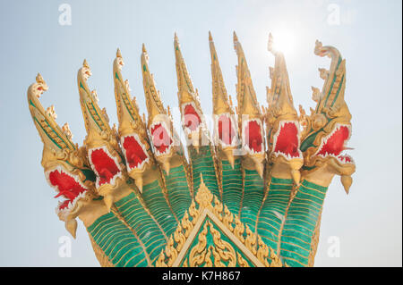 Green and Gold nine-headed naga protecting the entrance of the Teak ...