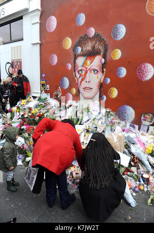 A view of notes written by fans and flowers pinned to the gates at Gigg ...