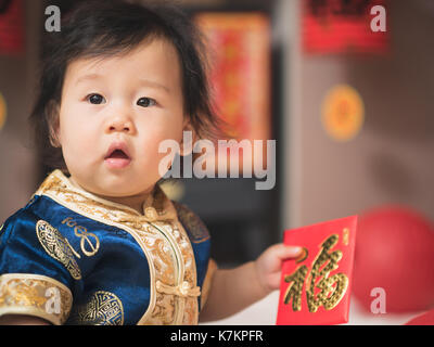 happy baby girl get red envelope with "FU" means lucky for her first ...