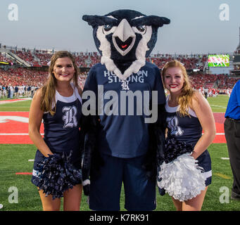 Sammy the Owl, mascot of the Rice Owls, leads the Rice football team ...