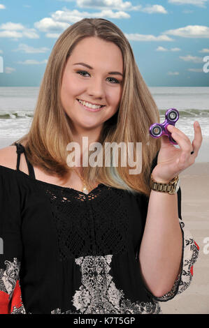 Popular fidget spinner toy that is the latest fad Stock Photo - Alamy