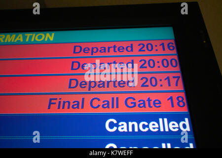 Airport departures information screen with Final Call in red Stock ...