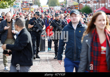 Police keep watch outside the ground ahead of an organised protest ...