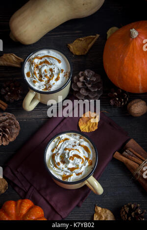 Hot Chocolate with Pumpkin Pie Spices over dark wooden background with ...