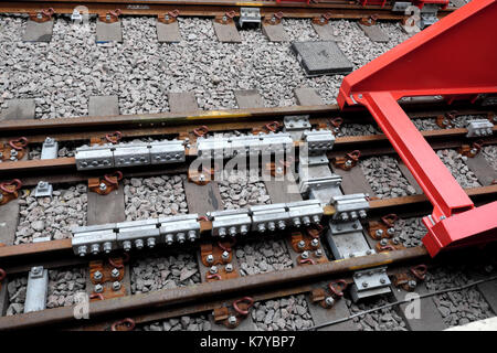 New red friction buffers on the rail tracks at Swansea train station in ...