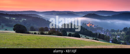 View of Lauenstein Castle and village, morning light, morning fog ...