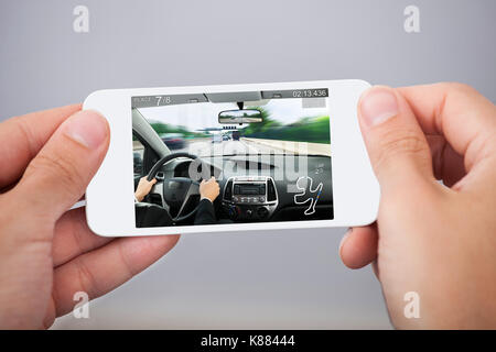 Close up of hands playing mobile gaming on smartphone for digital ...