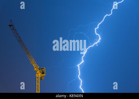 Crane struck by lightning, powerful thunderbolt. Weather risk ...