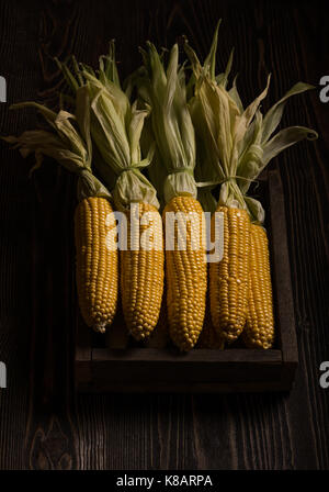 Fresh corn on cobs on a rustic wooden table. Copy space Stock Photo - Alamy