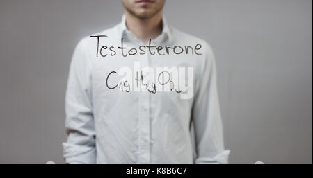 Testosterone , Man Writing on Glass Stock Photo - Alamy