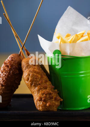 Sweet baked corn in a deep plate, served with chamichurri sauce and ...